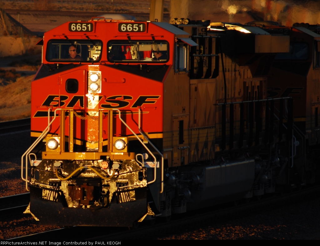 BNSF 6651 leads a westbound Z as the sun sets on the crew and this Very Brand New ES44C4.
